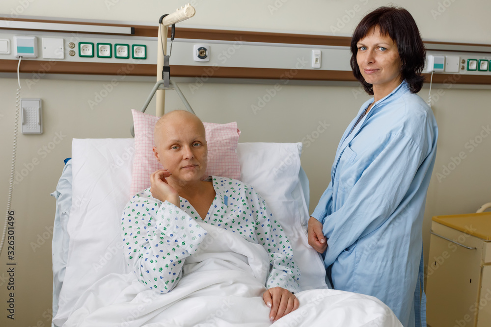 Woman without hair after chemotherapy patient lying at hospital bed ...