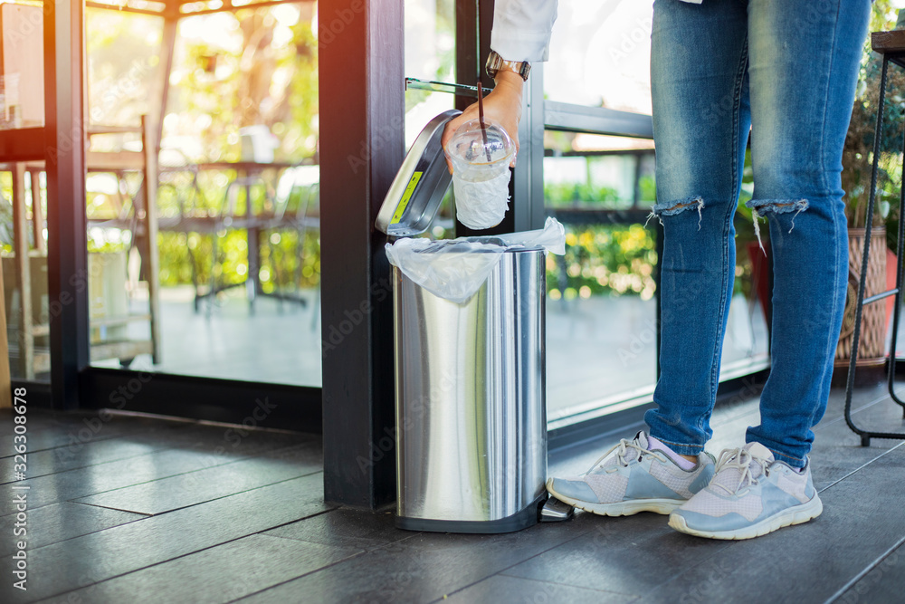 People are throwing garbage into the trash.Stainless steel trash in the ...