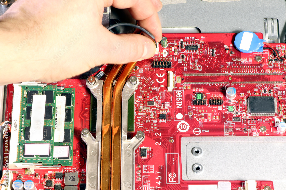 Fixing mothe board. Computer mother board with chip components and ...