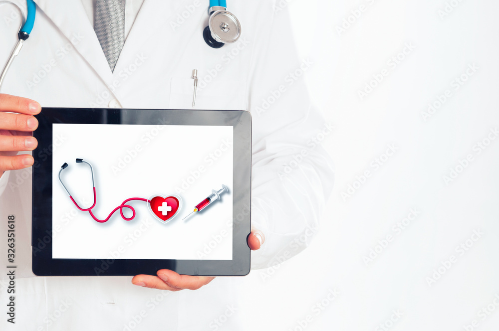 Doctor holding tablet with stethoscope on a white background. Healthy ...