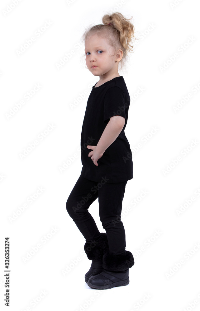 Little girl model in dark clothes posing. Five year old girl in full ...