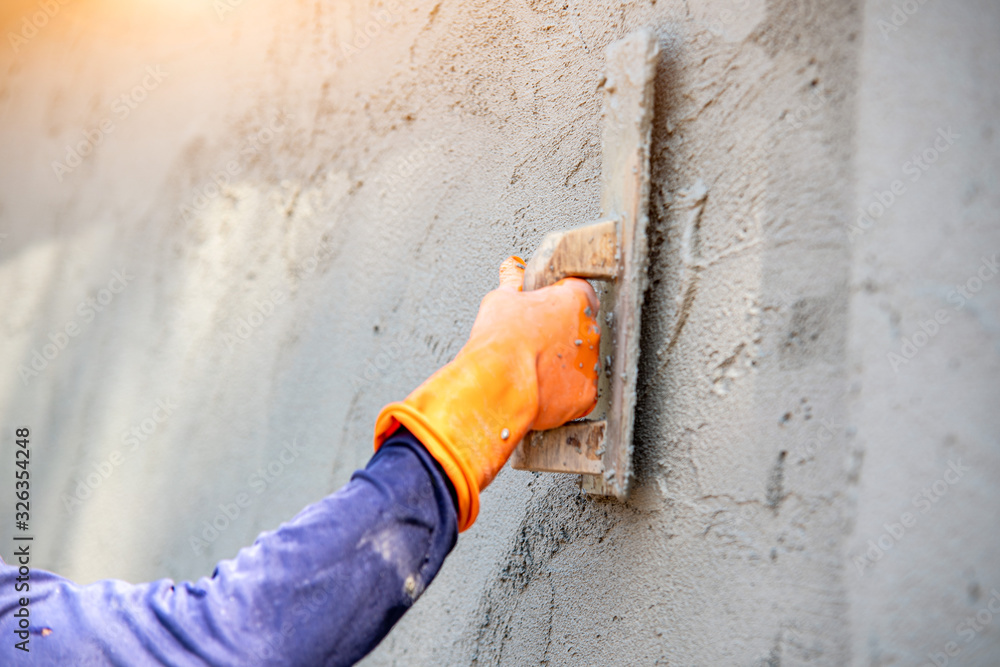 Mason plastering the concrete to build wall,Construction under building ...