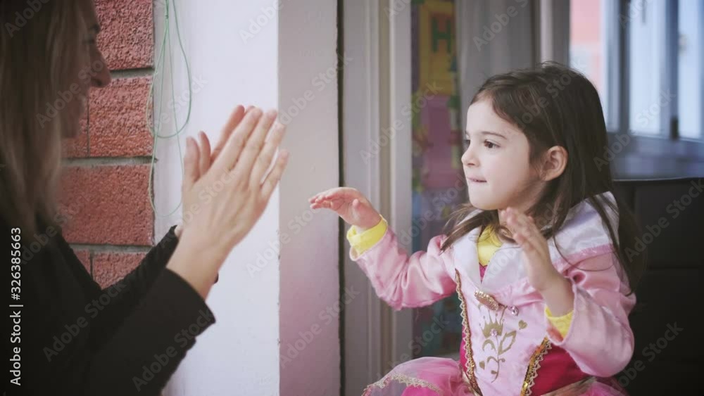 clapping hands play patty cake game mom and baby girl child dressed as ...