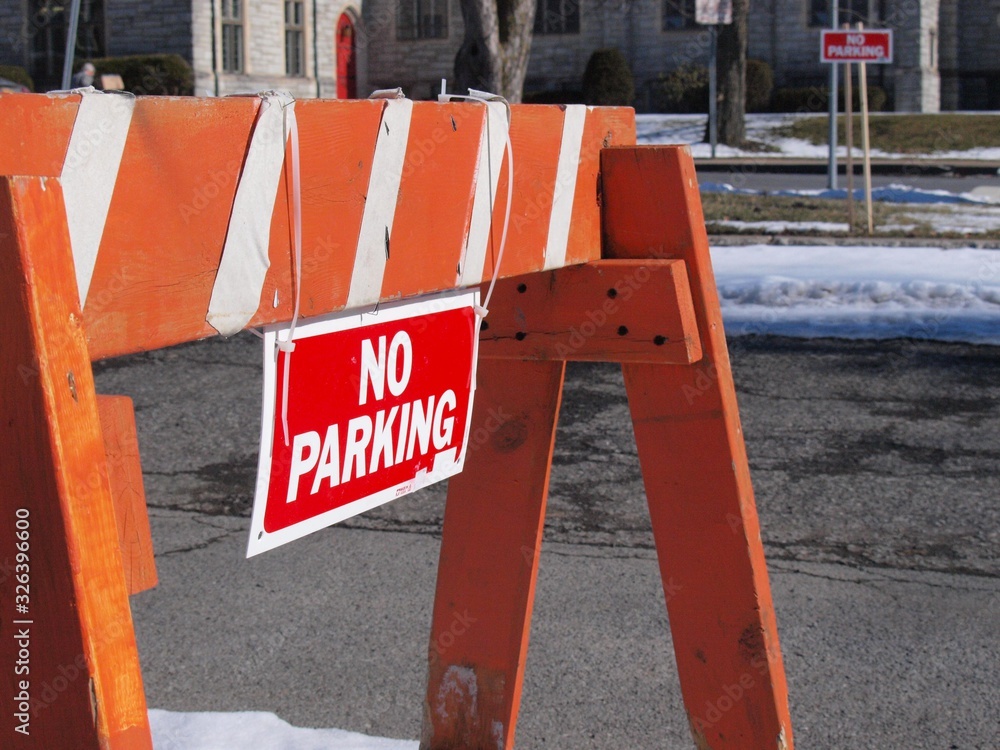 Serious No Parking signs and barricade in a parking lot Stock Photo ...