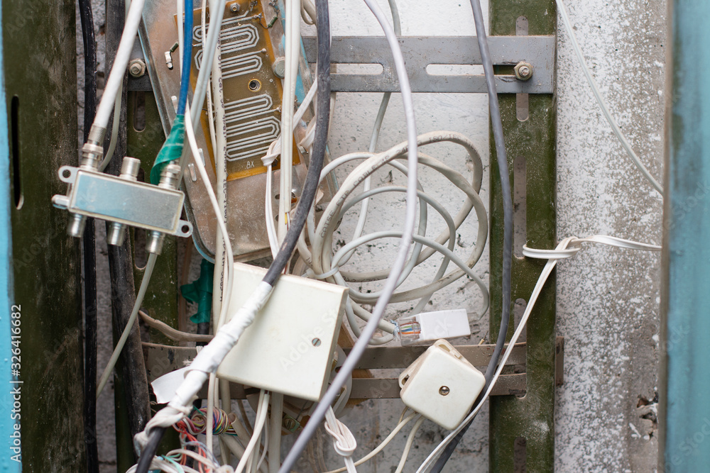 tangled wires in an electrical cabinet for an apartment building Stock ...
