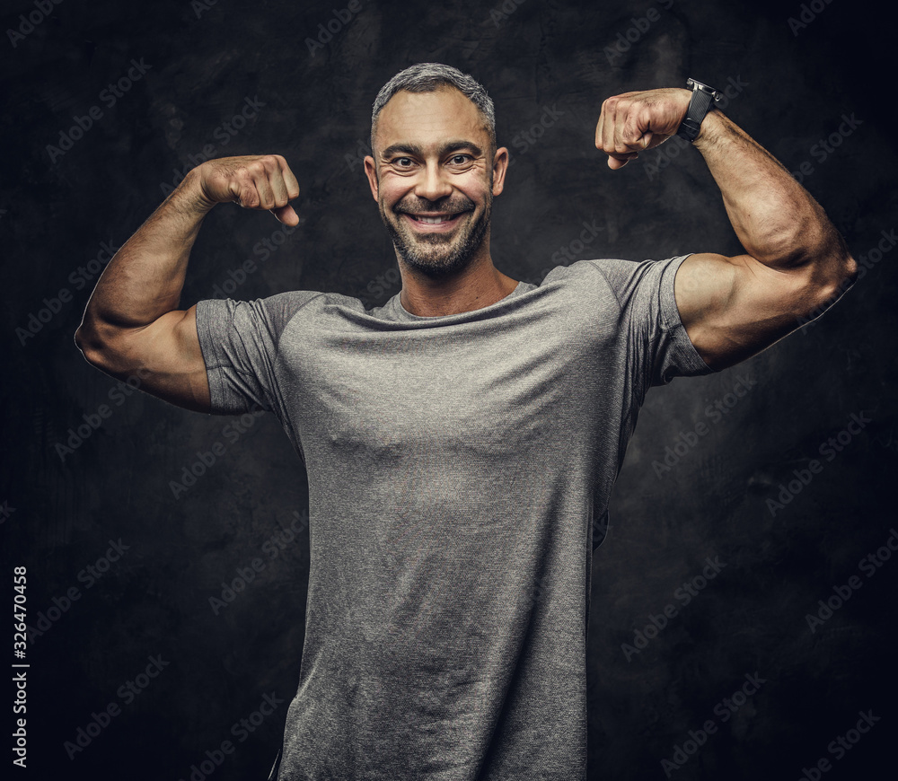 Strong, adult, fit muscular caucasian man posing for a photoshoot in a ...