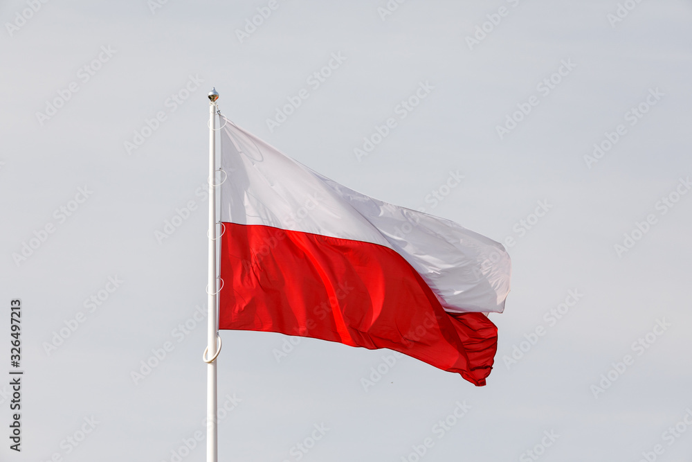 National flag of Poland waving on the wind in Gdansk Stock Photo ...