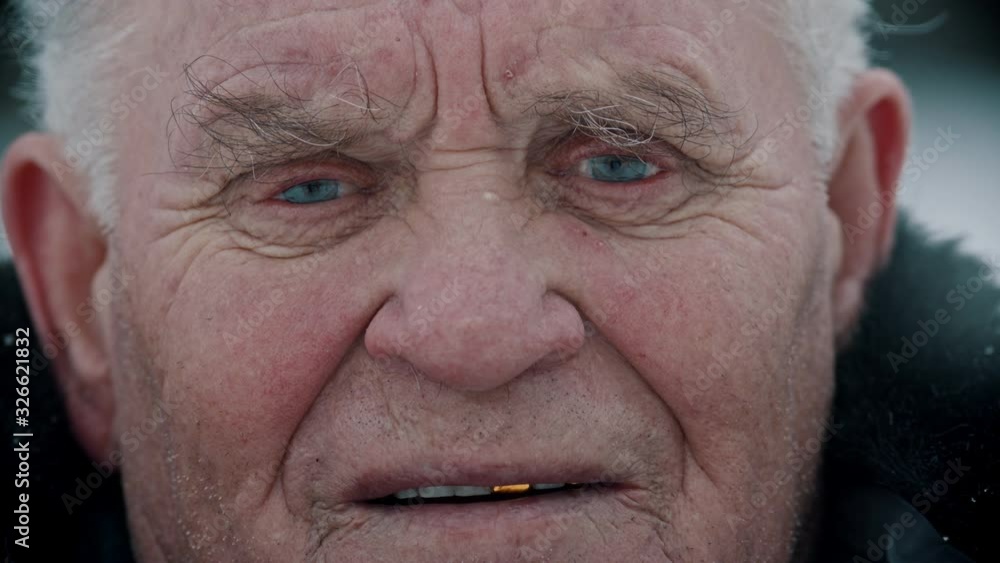 Elderly grandfather - portrait of a smiling grandfather with golden ...