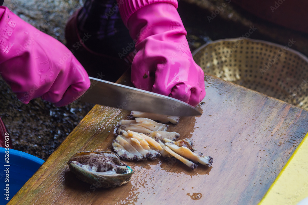 hand slice Fresh abalone shell sashimi , Jeju island , South Korea ...