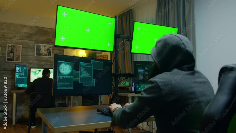Hacker with a hoodies making a dangerous malware Stock Video | Adobe Stock