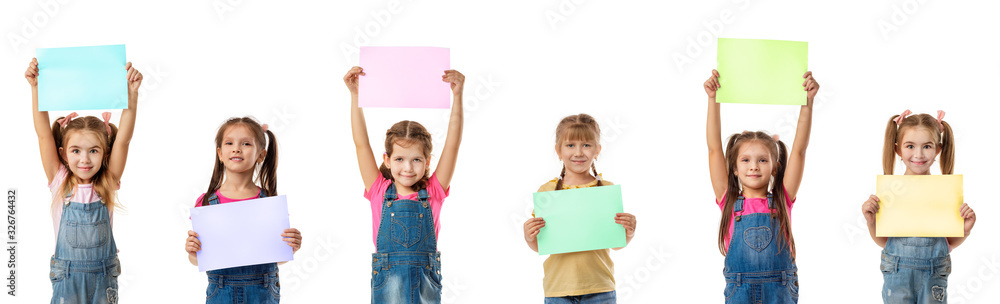 Happy cute children holding empty blank isolated on white background ...