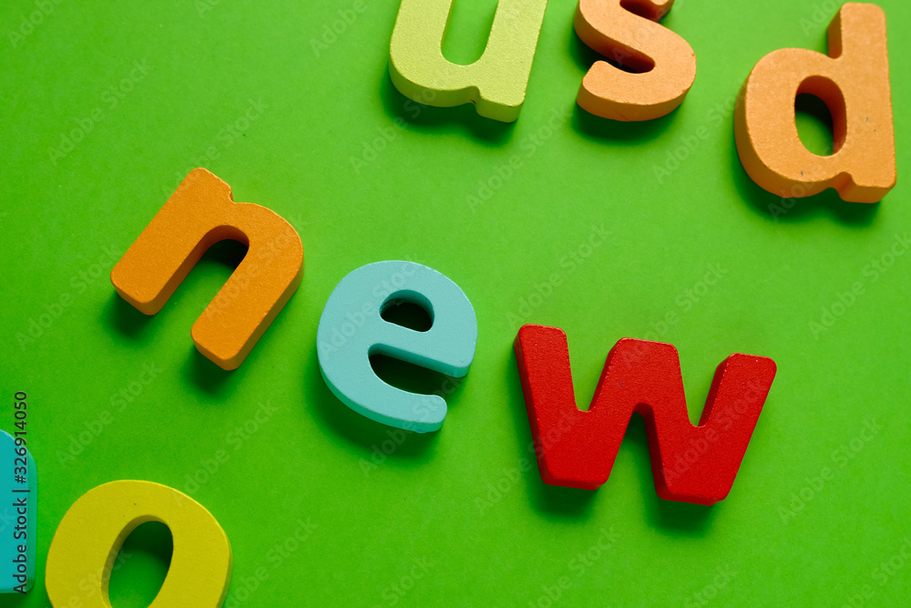 Word NEW on green background. Learning the English alphabet and ...