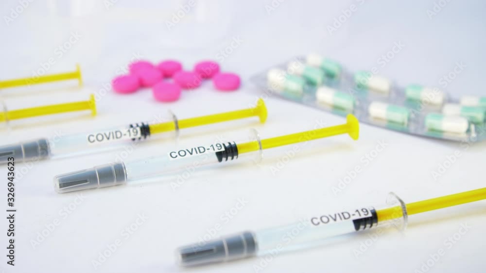 Coronavirus vaccines ready to be applied. Hand of a Sanitary worker ...