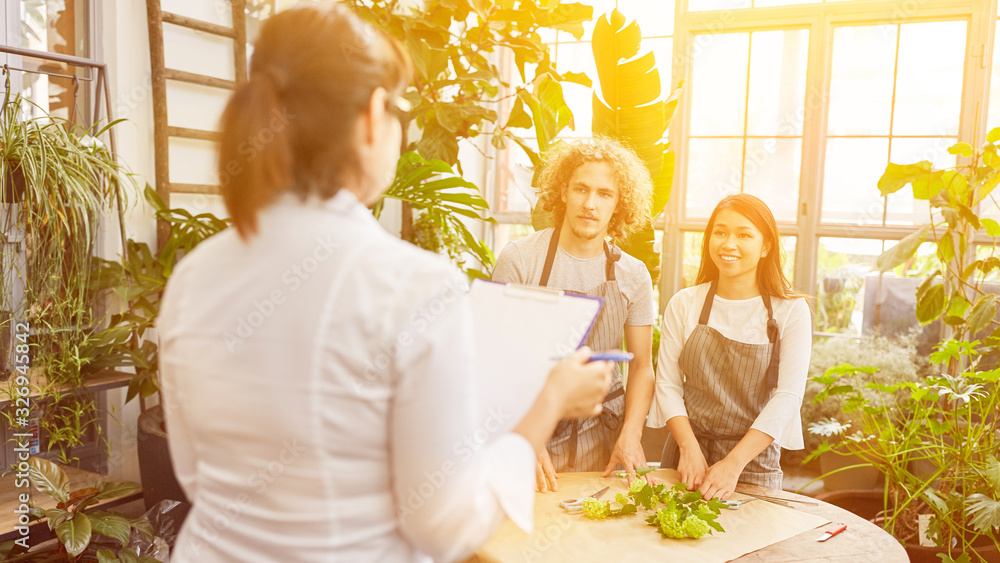 Two florists at final exam of training Stock Photo | Adobe Stock