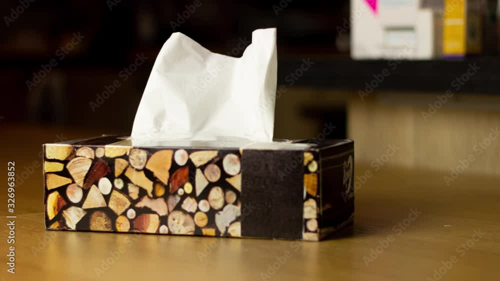Stop motion animation. Hand taking a tissue from a tissues box. Concept ...