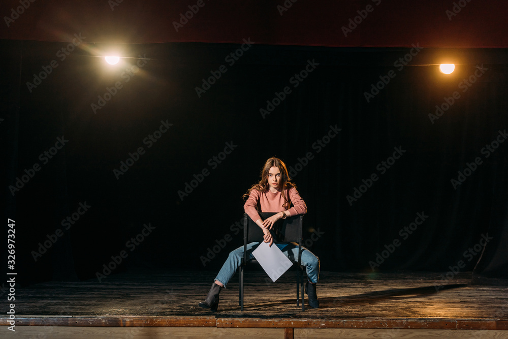 attractive young actress with scenario performing role on stage in ...