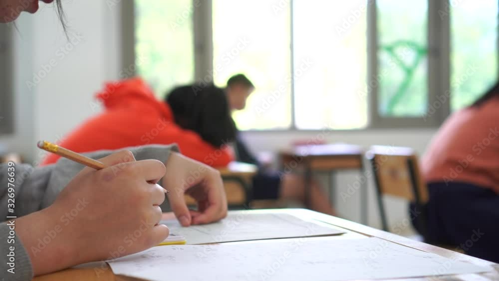 Student hand testing doing test exam with pencil drawing selected ...