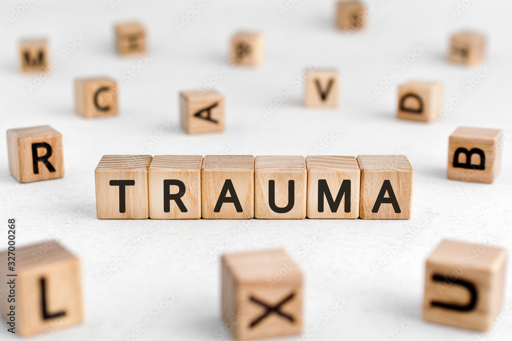 Foto de Trauma - words from wooden blocks with letters, physical or ...