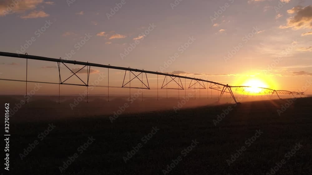 Pivot irrigation used to water plants on a farm. Smooth motion at ...