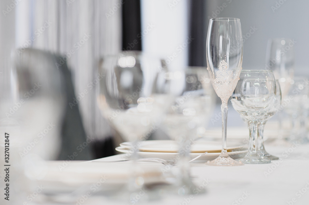 Glasses on the festive table setting. Wedding table decor concept ...