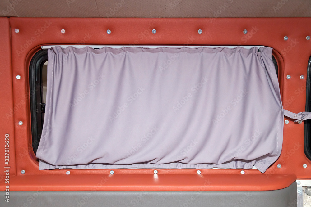 Violet textile curtain on the passenger car window of the van Stock ...