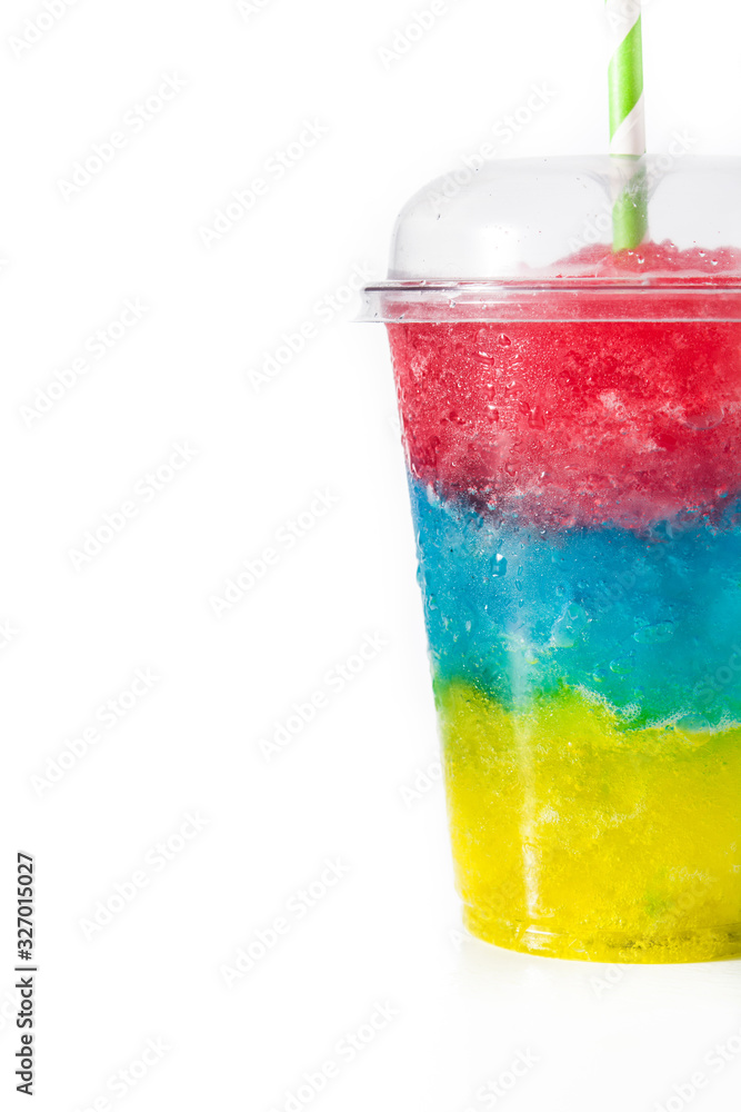 Colorful slushie of differents flavors with straw in plastic cup ...
