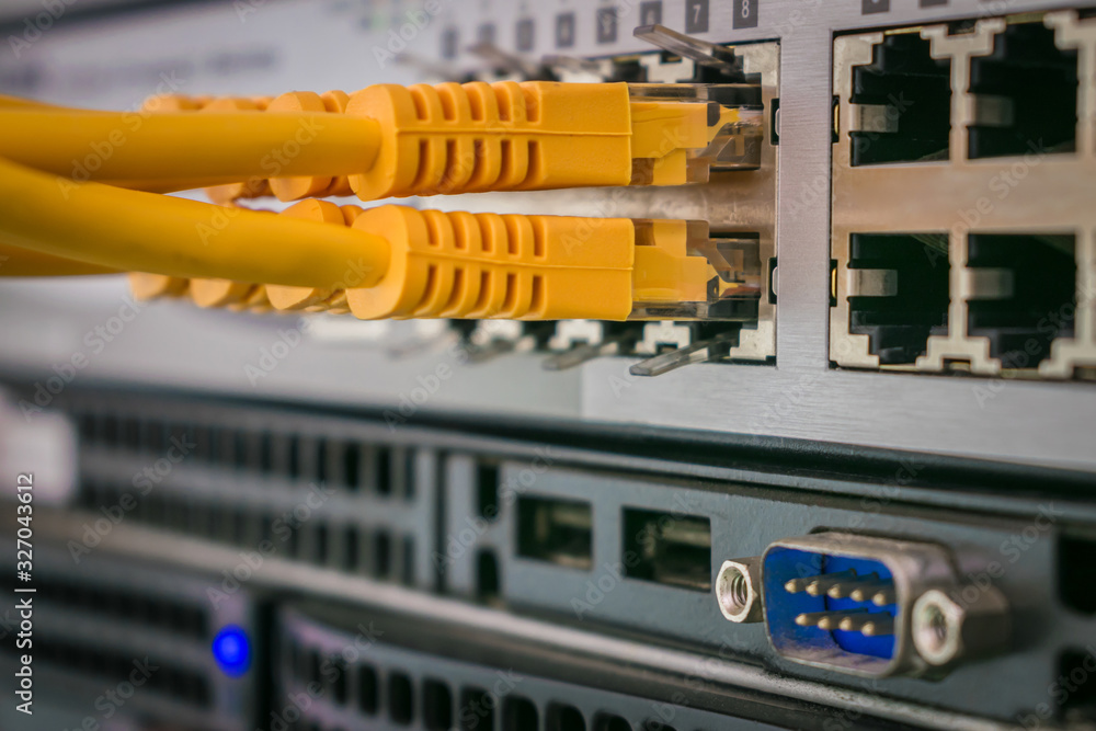 Yellow utp cables connect to the network interfaces of the Internet ...