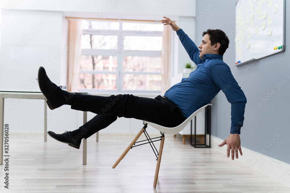 Man Falling On Chair In Office Stock-Foto | Adobe Stock