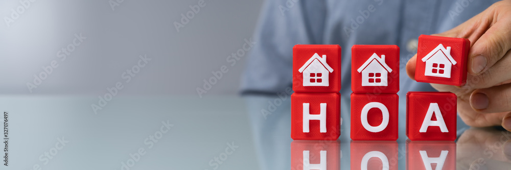 Businessman Placing House Models On HOA Cubic Blocks Stock Photo ...