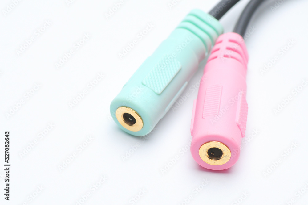 Audio video adapter cable with trrs jack to trs connectors on a white ...