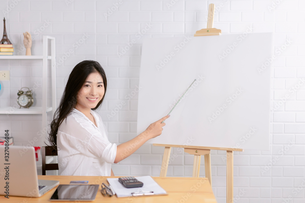 Confident female Asian woman conference speaker coach training on blank ...