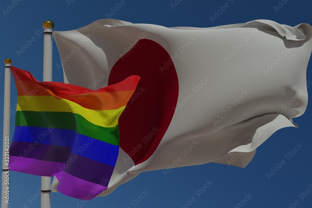 LGBT flag and the flag of Japan on a pole waving in the wind together ...
