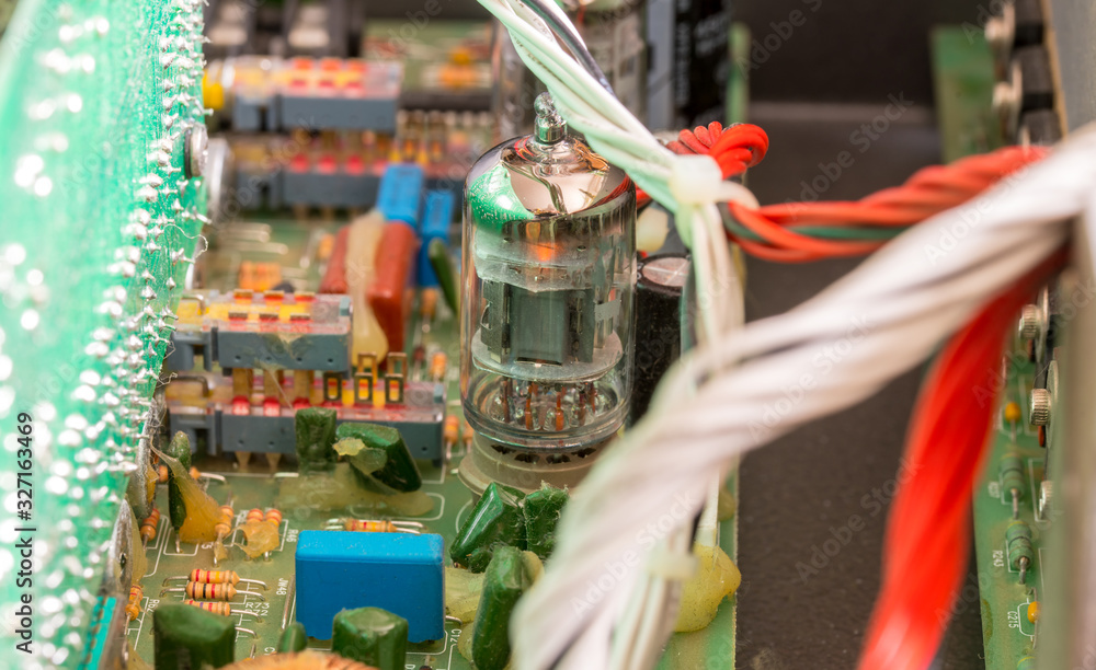 Electrical assembly with tube on a circuit board with electrical ...