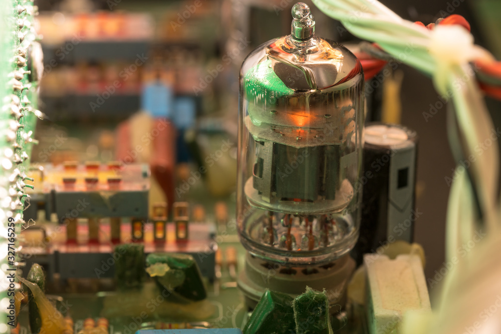 Electrical assembly with tube on a circuit board with electrical ...