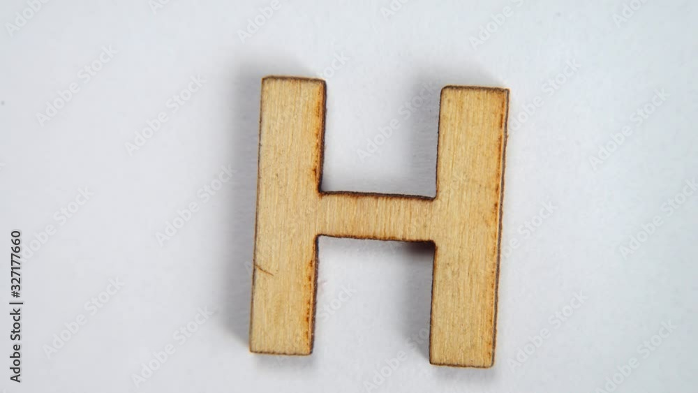 Dancing letter H of the English alphabet on a white background made of ...
