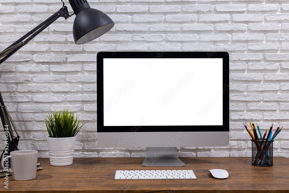 workspace with computer with blank white screen mockup, and office ...