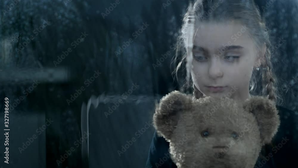 Worried Girl Cuddles Closely With Her Teddy Bear. The Storm Makes The ...