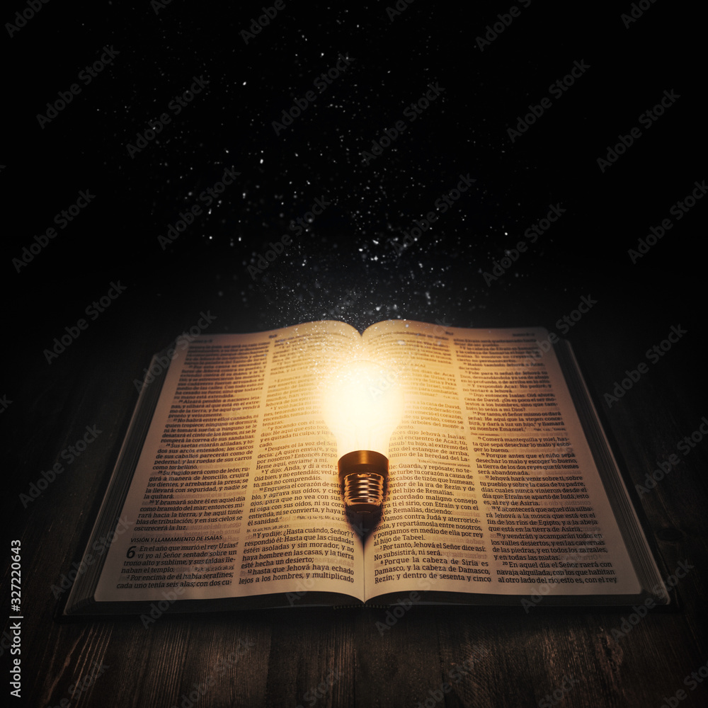 Light bulb lighting up an open bible Stock Photo | Adobe Stock
