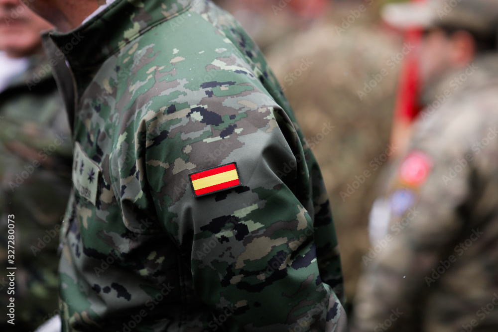 Details with the uniform and the flag on it of a Spanish soldier taking ...
