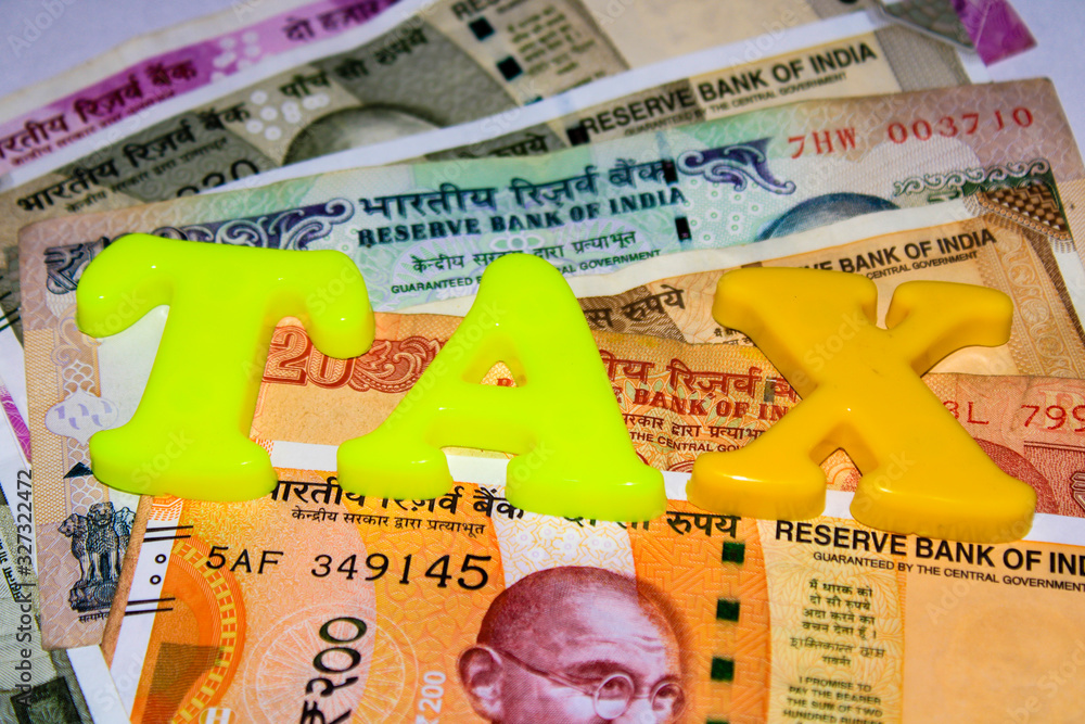 Time to pay TAX concept. TAX alphabet with Indian currency notes and ...