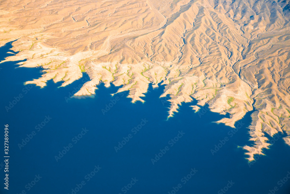Aerial Photography of landforms over Nevada with Lake Mead in view ...