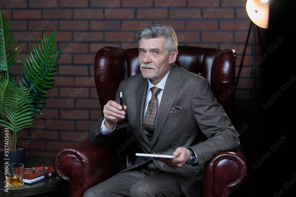 Portrait of successful millionaire and mature handsome old man sitting ...