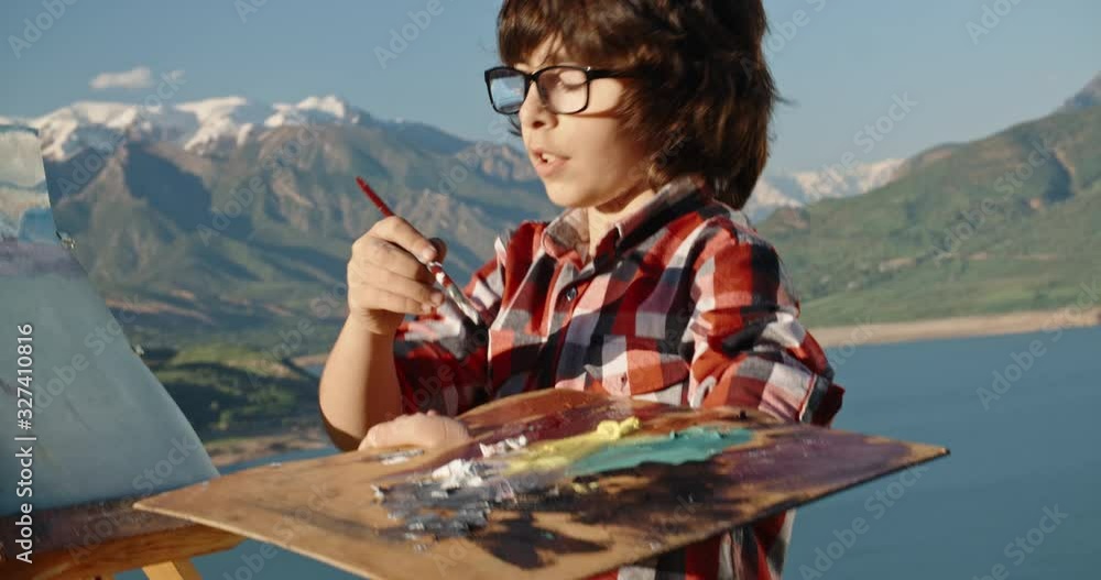 Young kid learning how to draw by creating a picture, inspired by ...