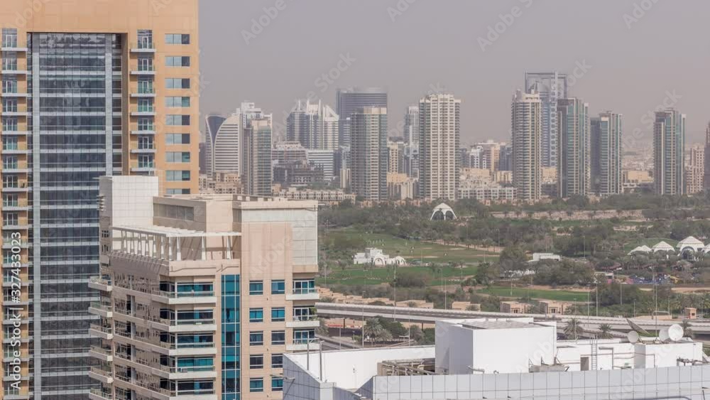 Dubai Golf Course with a cityscape of Gereens and tecom districts at ...