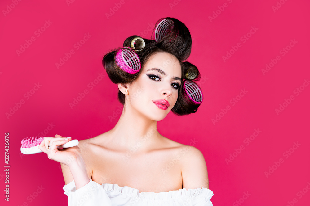 Hair curlers. Portrait of beautiful woman with hair curlers. Fashion of ...