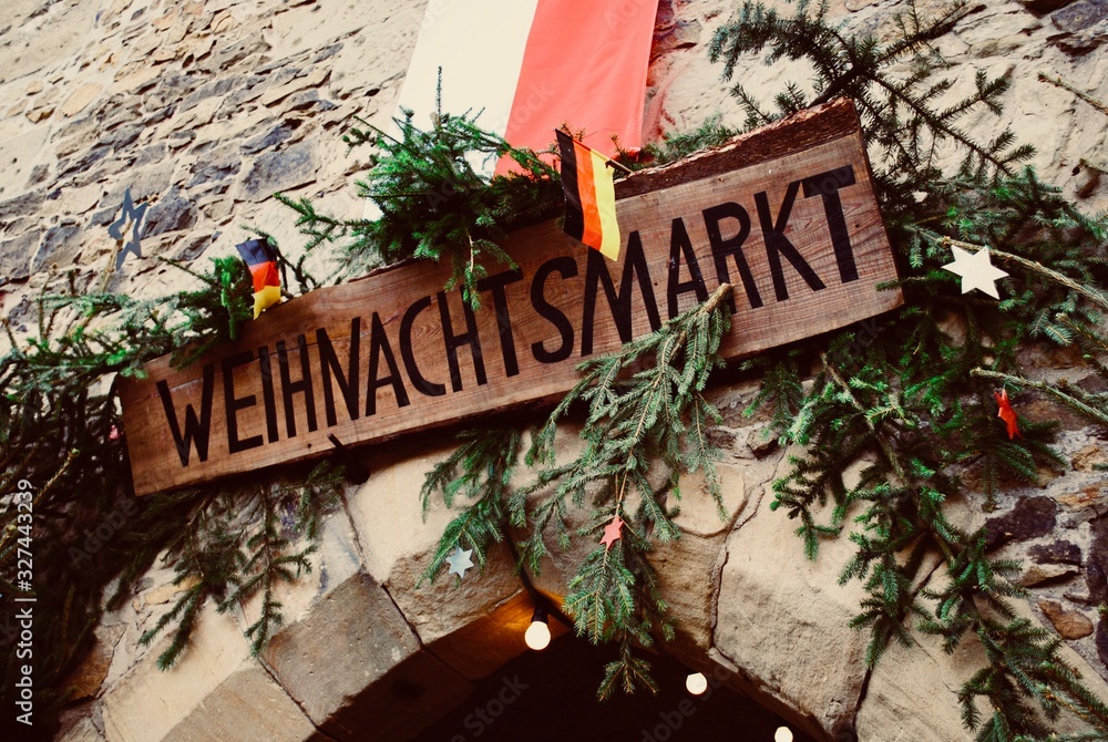 Weihnachtsmarkt means Christmas Market in German. German flags welcome ...