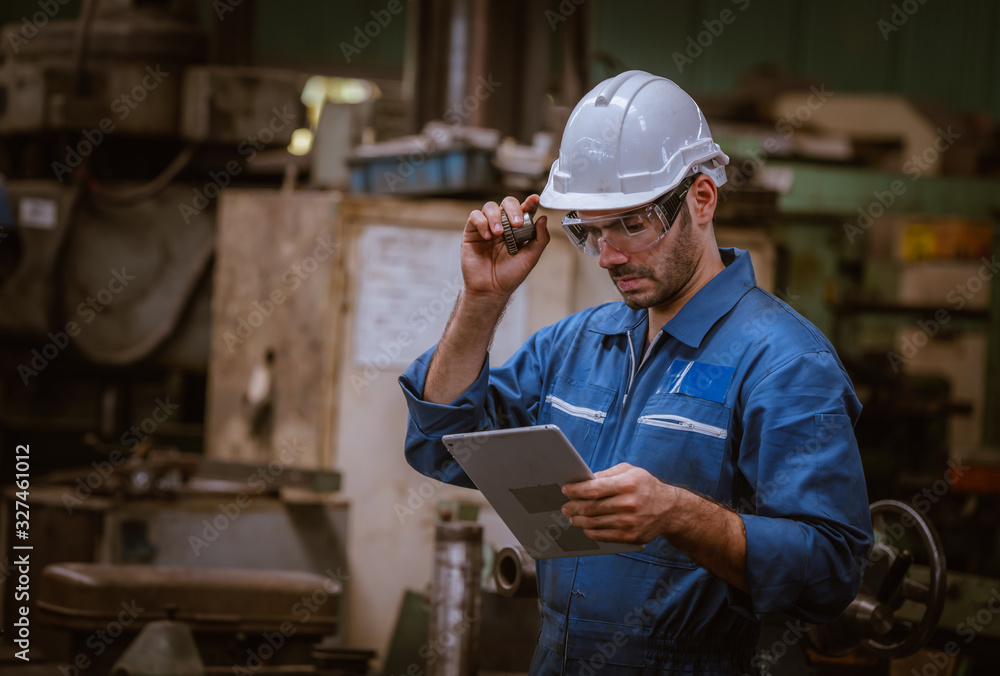 Industry engineer under inspection and checking production process on ...