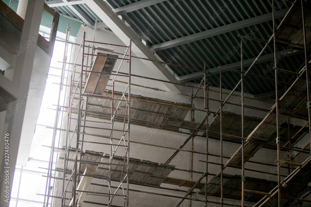 Scaffolding and wall plastering in buildings are under construction ...