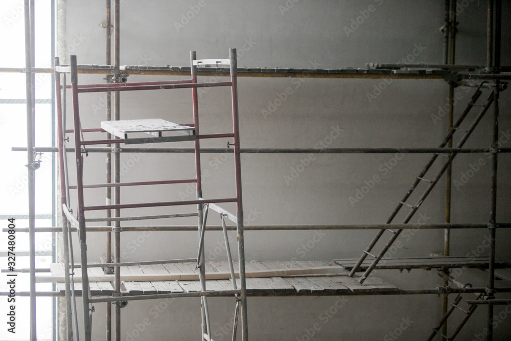 Scaffolding and wall plastering in buildings are under construction ...