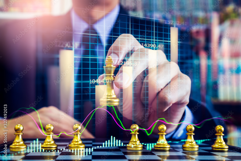 Chess game on chess board on stock market or forex trading graph chart ...